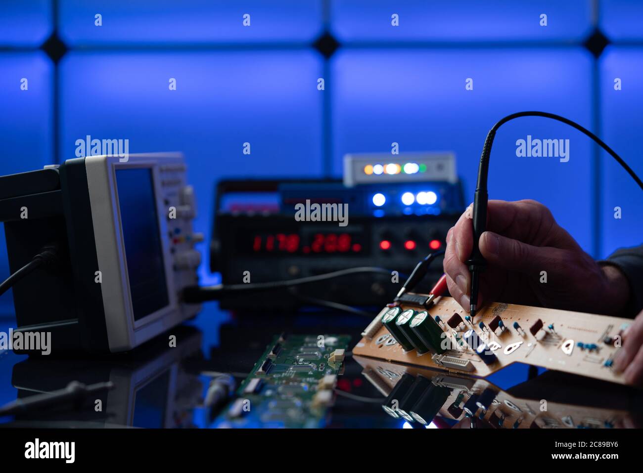 Debugging electronics device. PCB witch microcontroller in electronics ...