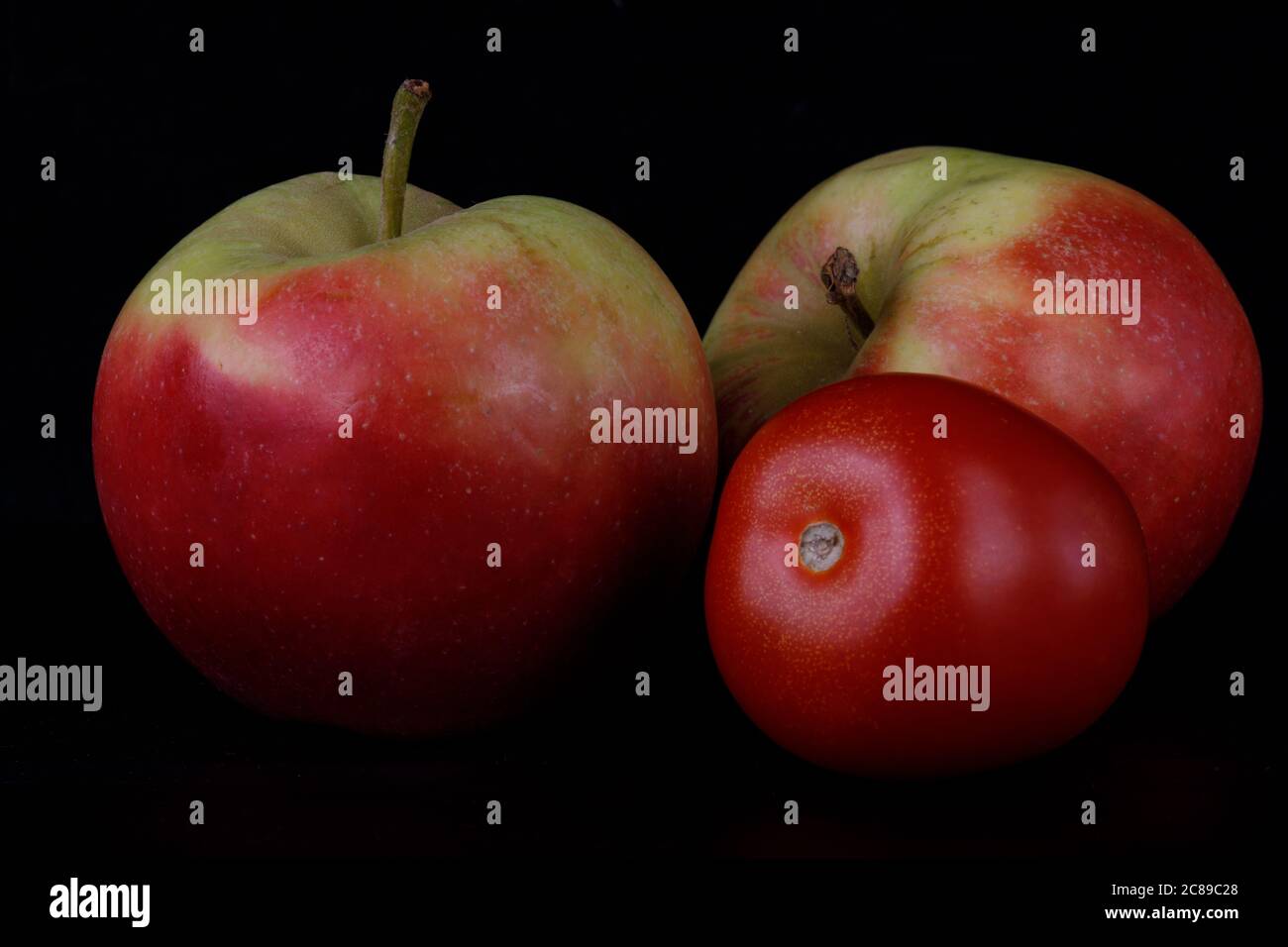 Still life of two apples and a tomato not the most usual combination ...