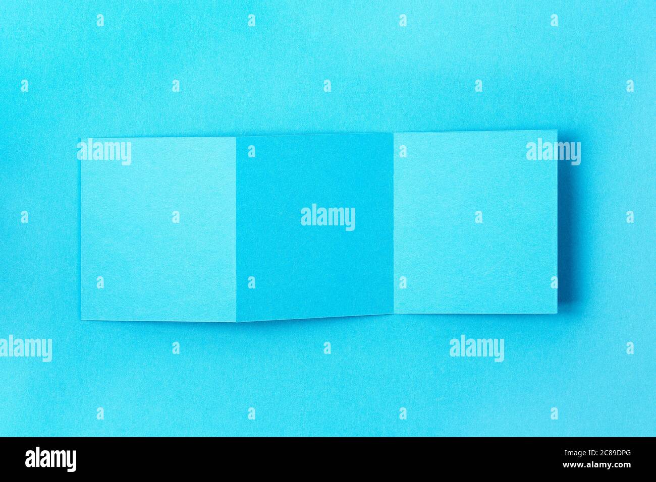 Folded paper blue squares hi-res stock photography and images - Alamy