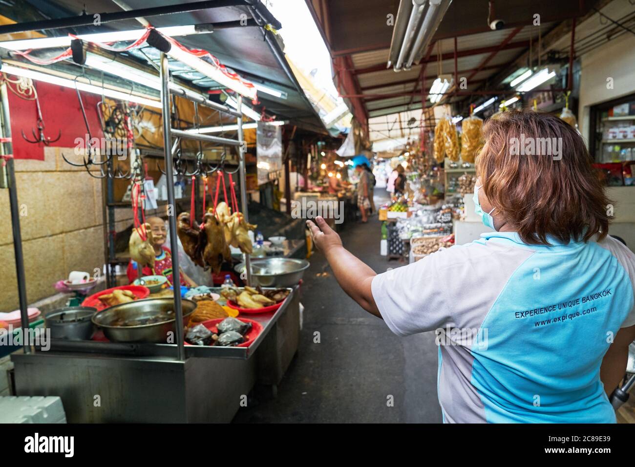 Guided by a local tour guide around a food market in Bangkok Stock ...