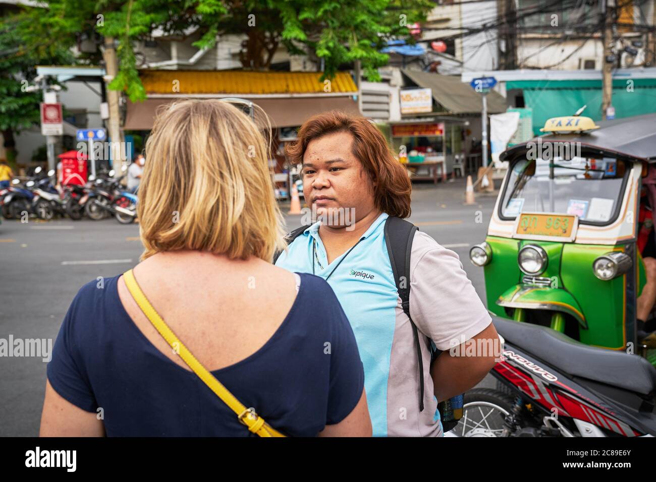 Guided by a local tour guide around Chinatown, Bangkok Stock Photo - Alamy