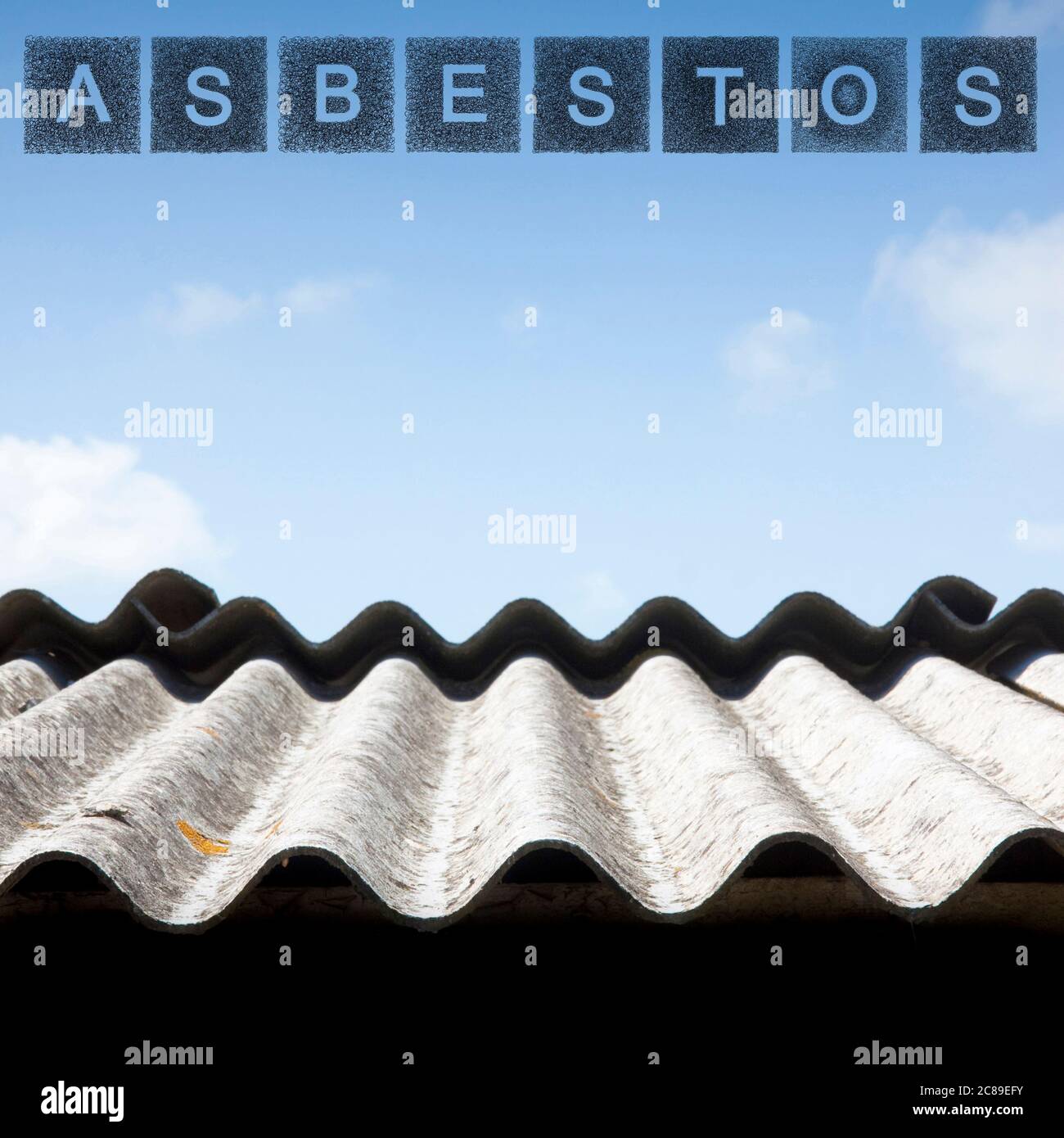 Dangerous asbestos roof. The word asbestos written with letters whose ...