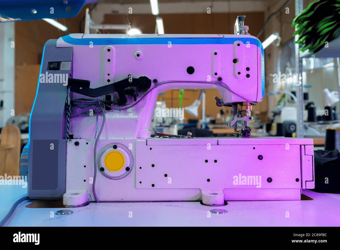 Sewing department of a textile factory interior Stock Photo - Alamy