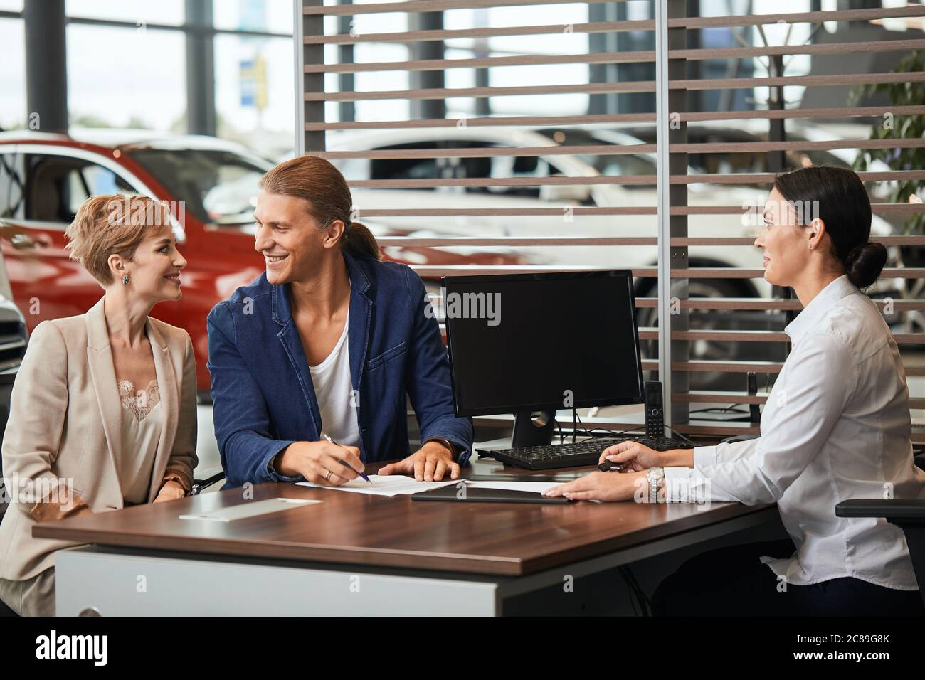 Car salesman sitting desk in hi-res stock photography and images - Alamy