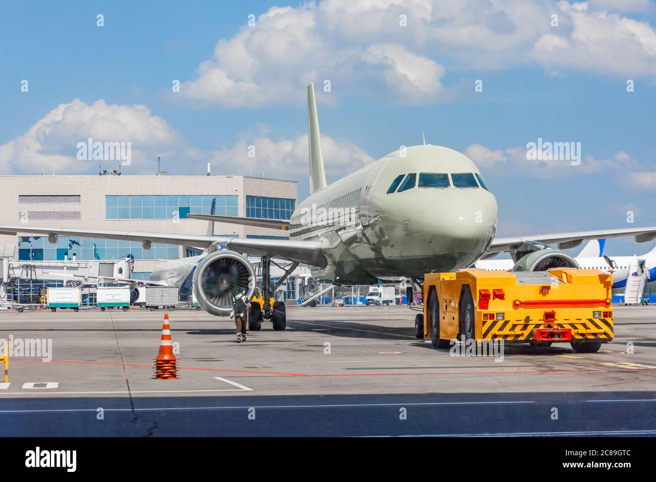 Towing a passenger plane using special equipment for aircraft ...