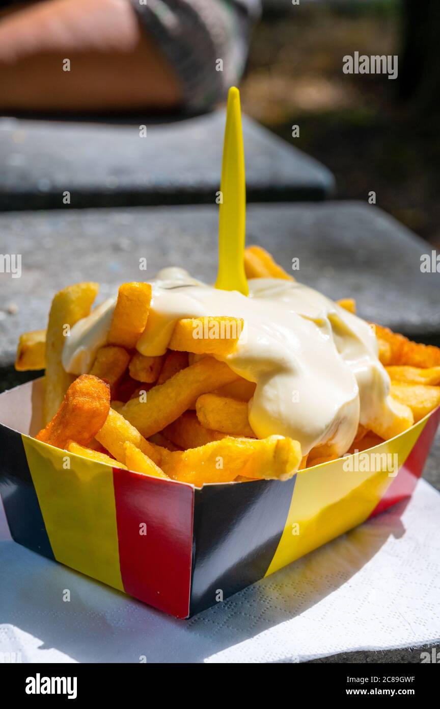 Belgian street and fast food, paper box in colors of Belgian flag with ...