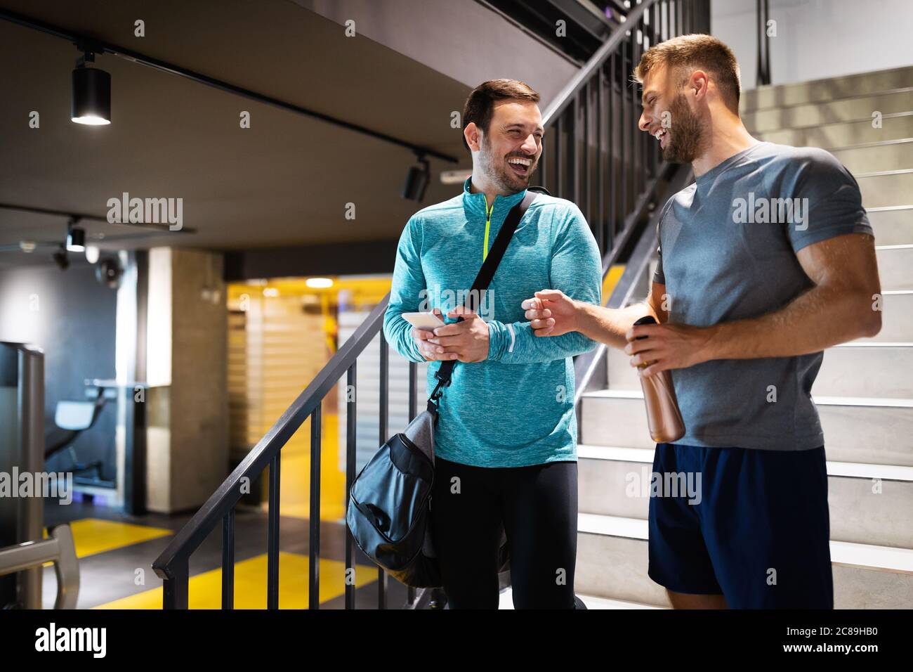 Sport, fitness, friends, lifestyle concept. Smiling men friends talking ...