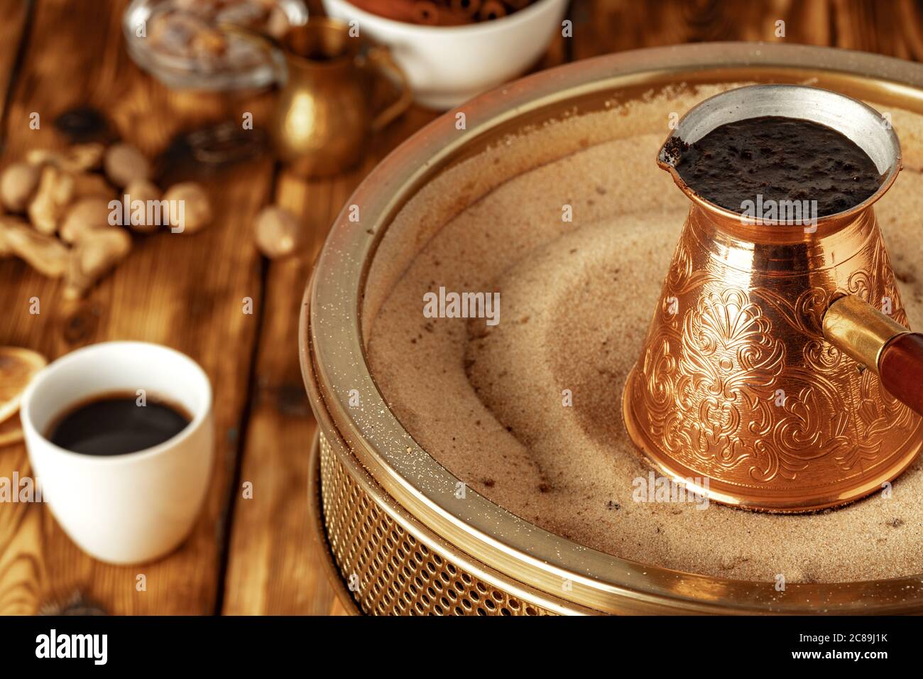 Turkish coffee in cezve on the sand Stock Photo - Alamy