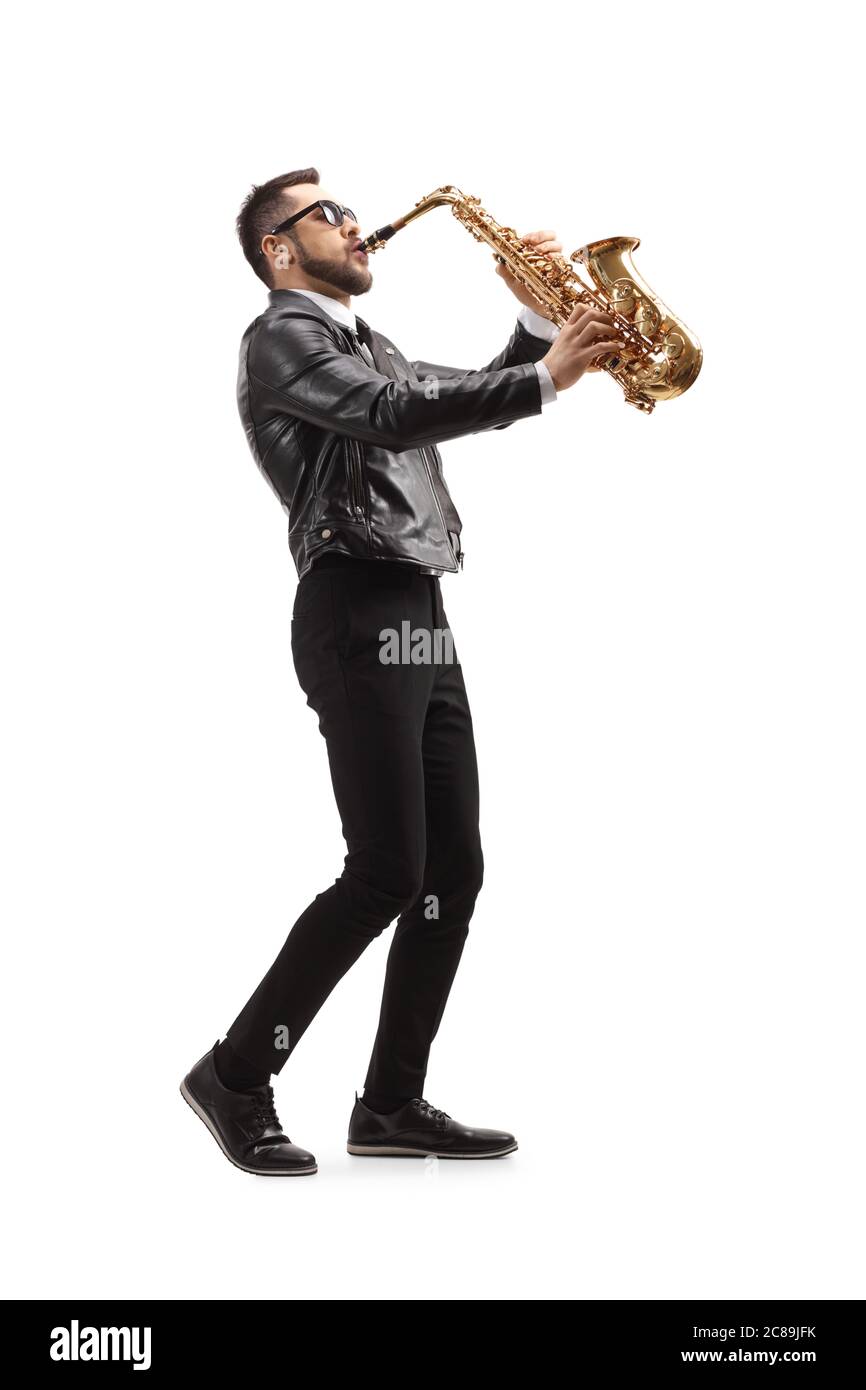 Full length profile shot of a musician playing a saxophone and wearing ...