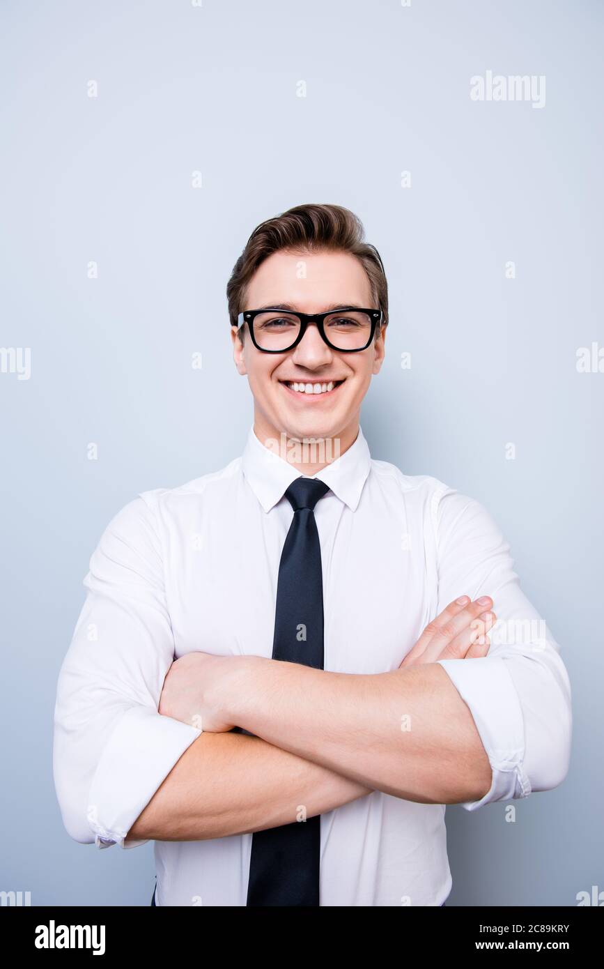 Successful young handsome geek is smiling. He is in a formal outfit and ...