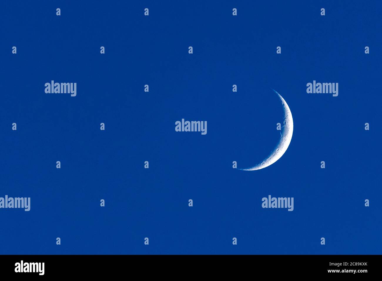 Sickle-shaped Moon in the Sky Stock Photo - Alamy