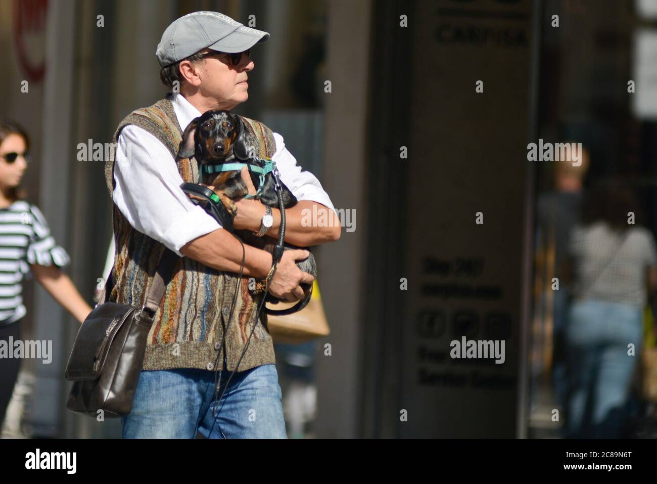 Man carrying his dog hi-res stock photography and images - Alamy