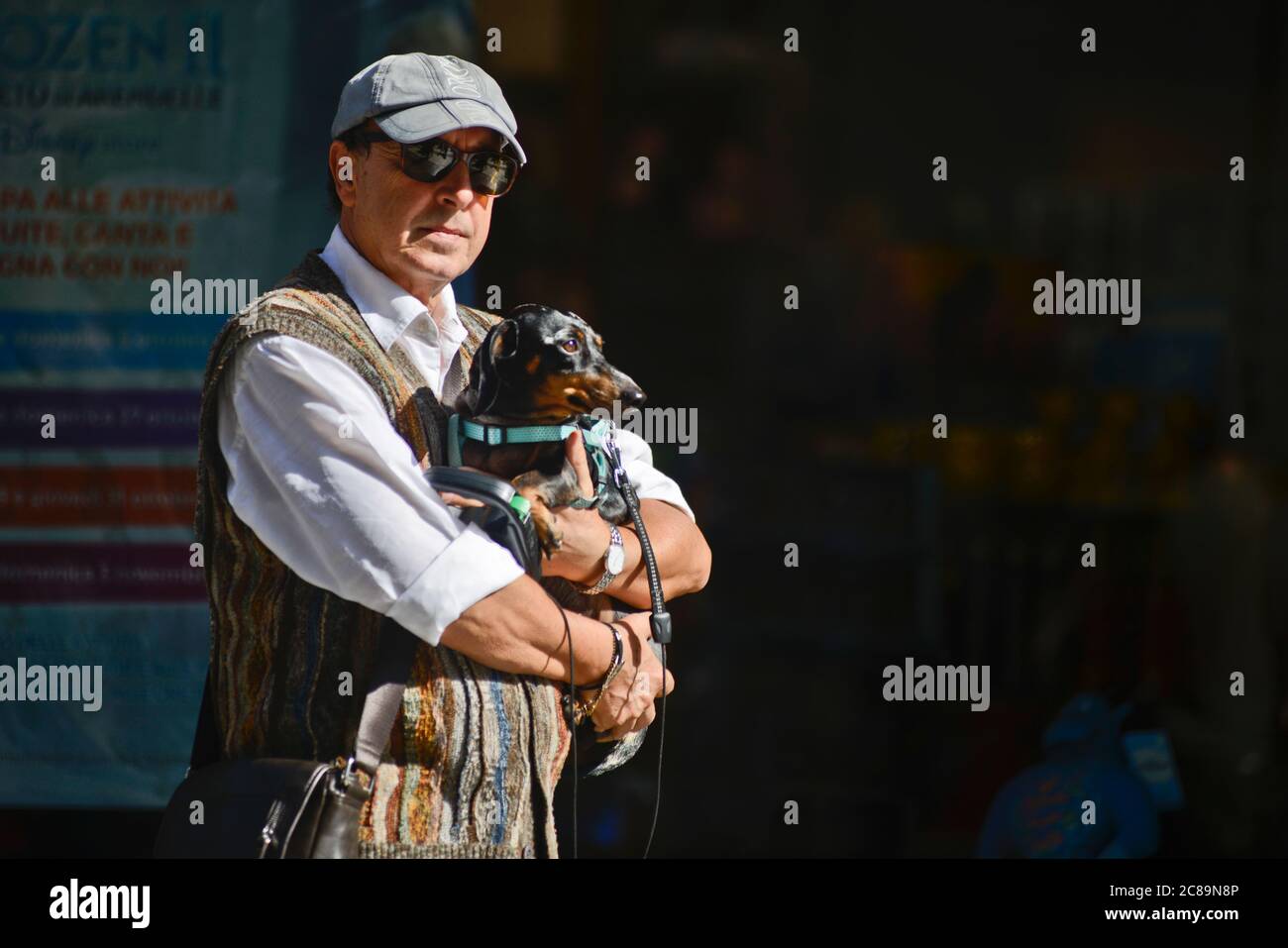 Man carrying his dog hi-res stock photography and images - Alamy