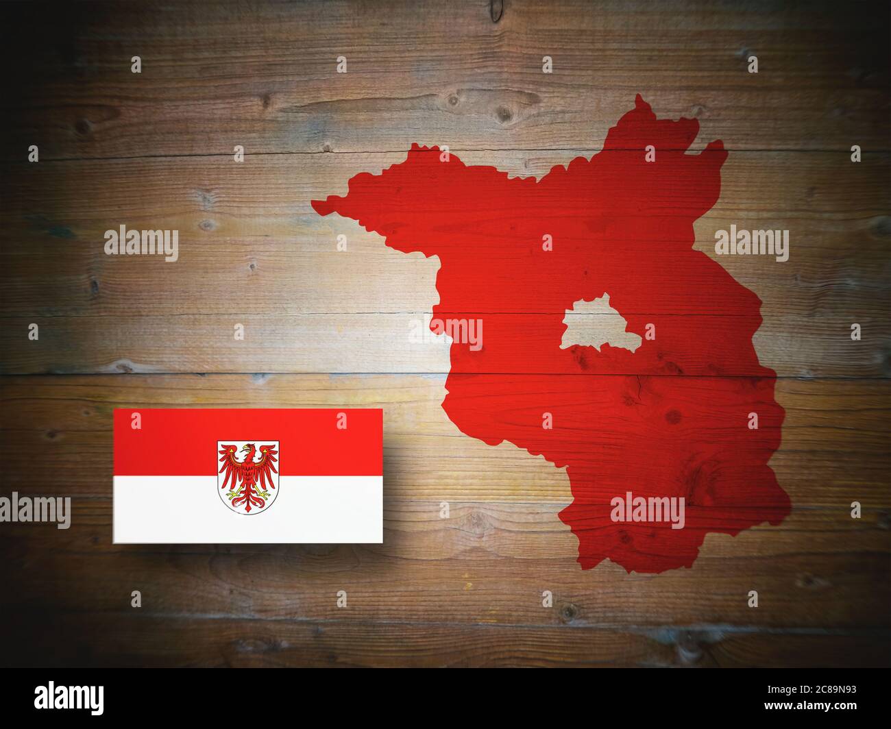 Map and flag of Brandenburg, German federal state, on wooden background ...