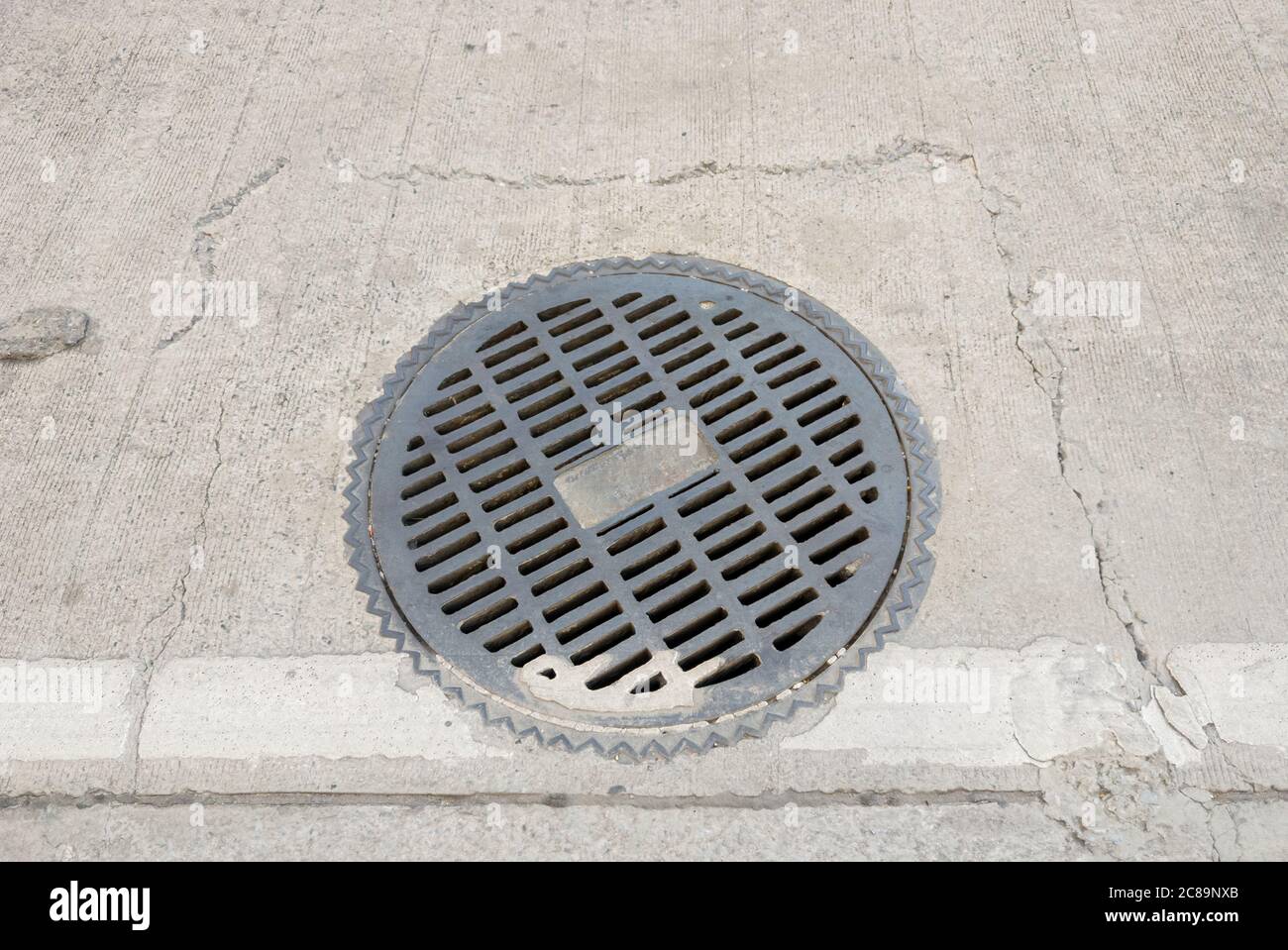 Metal manhole cover of the drainage system of the urban city on the ...