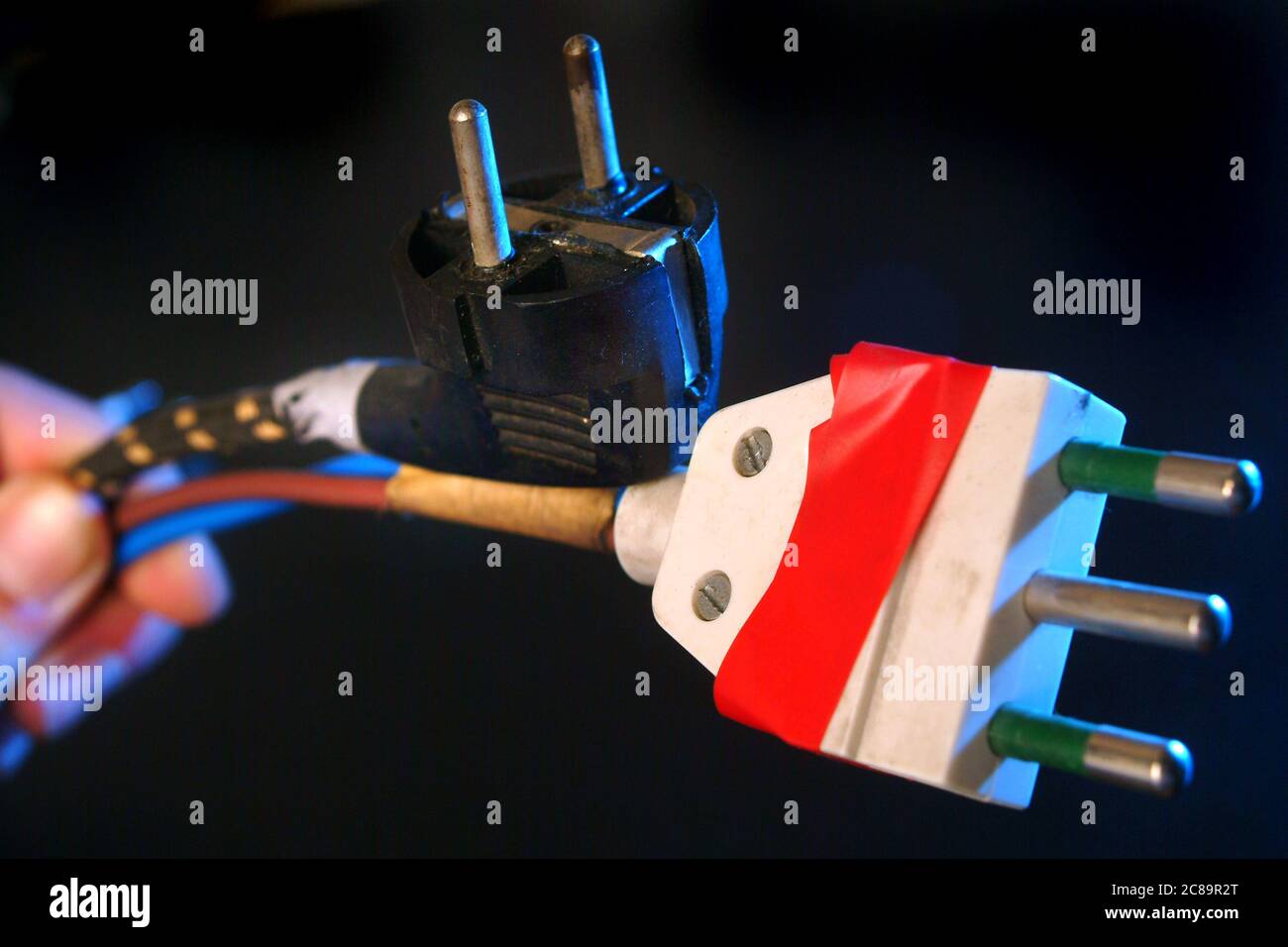 Domestic accidents, dangerous electrical plugs fixed with tape Stock ...