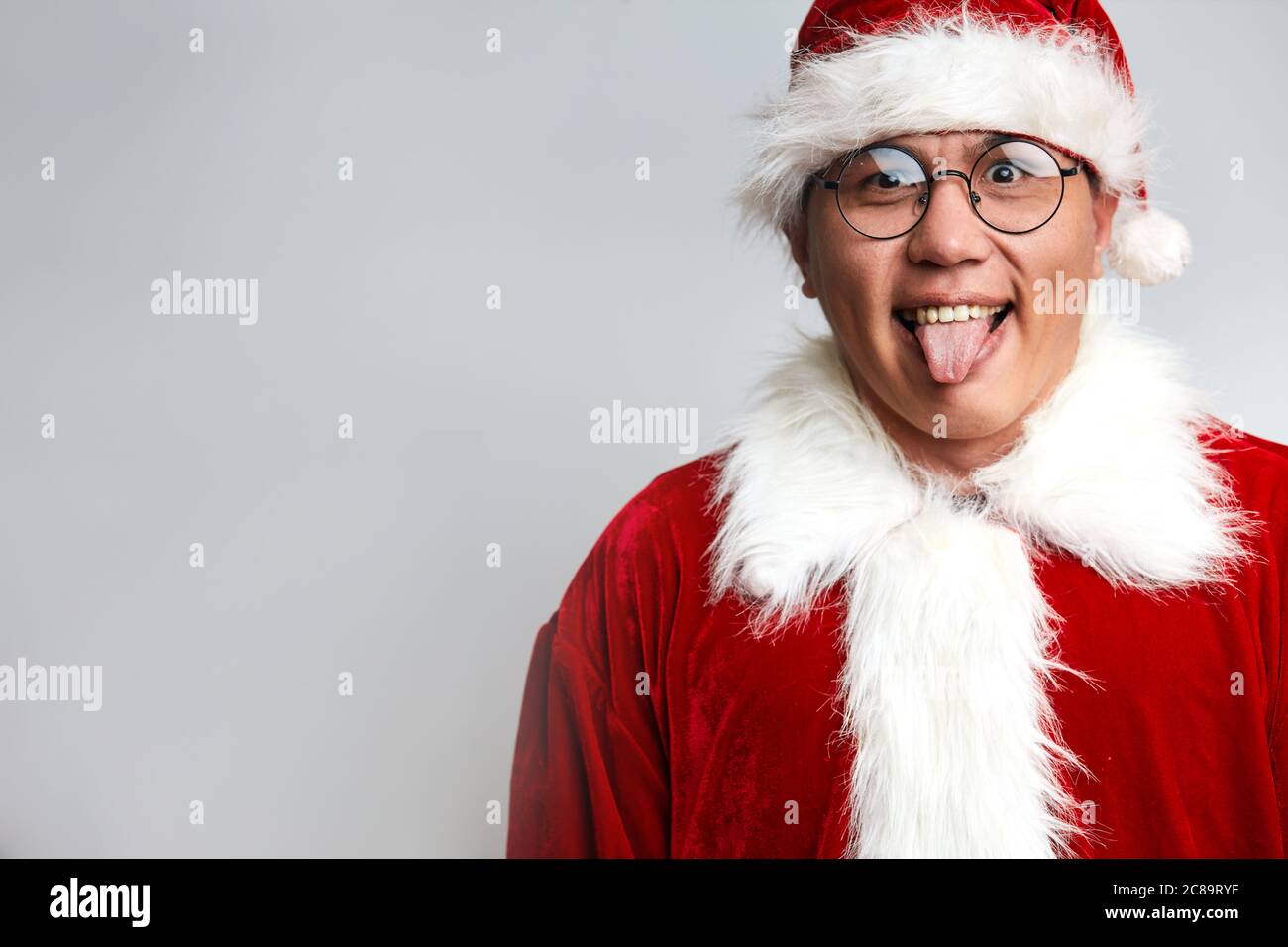 Funny handsome Santa Claus smiling and looking at camera with his ...