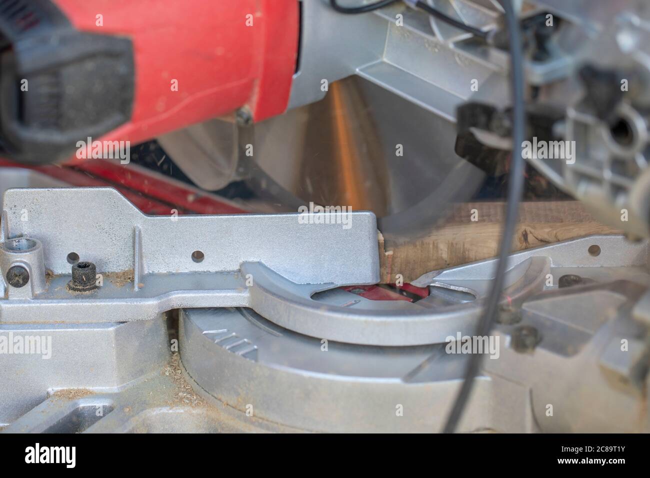 Sharp rotating circular saw blade cuts the oak beam into pieces Stock ...