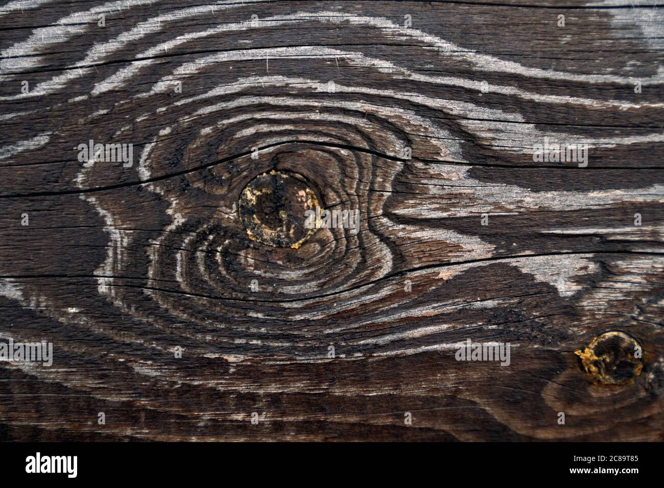 Brown aged volume rough rustic pallets on house wall outdoors, dark ...