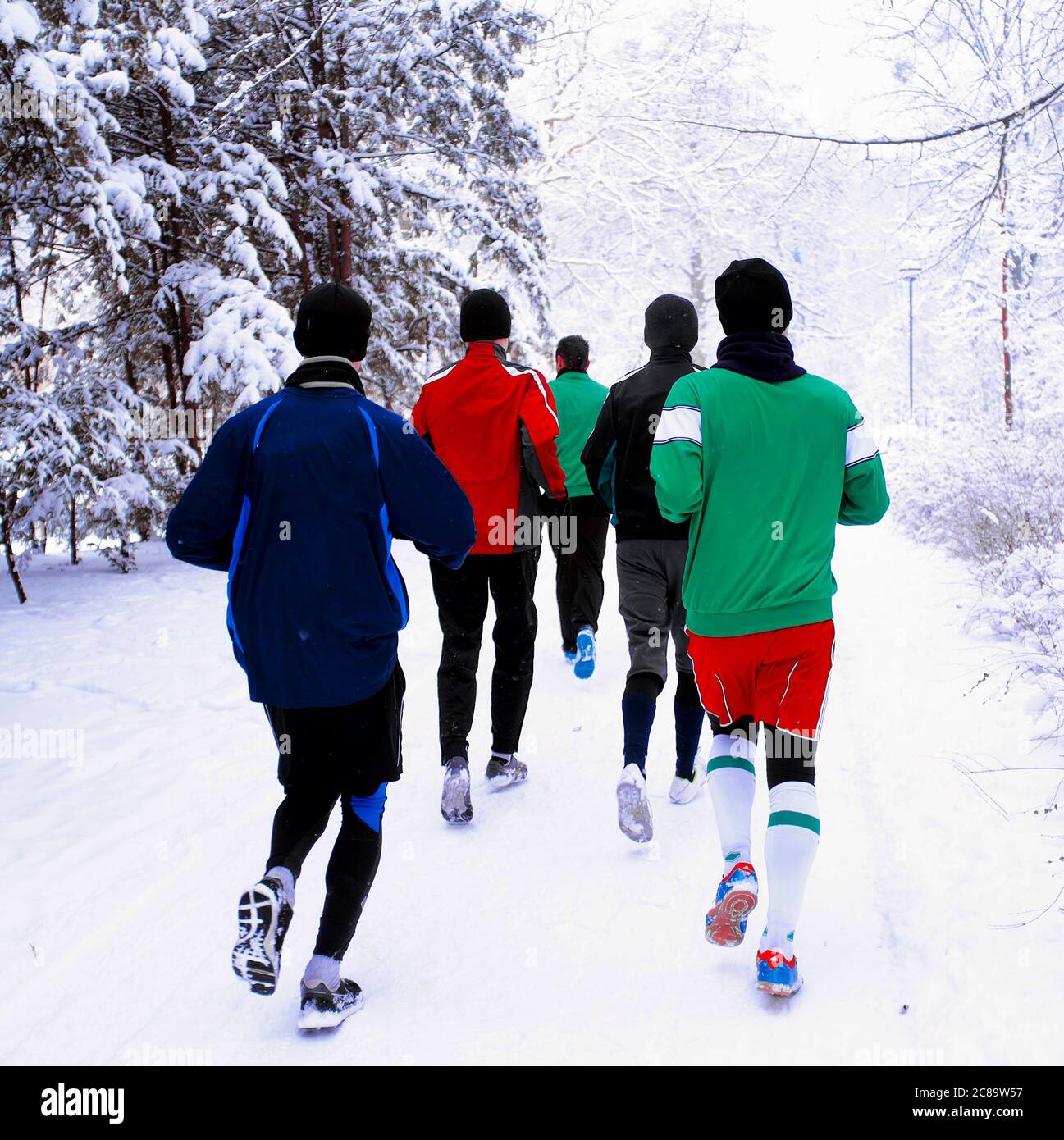 Young men train on snow Stock Photo - Alamy