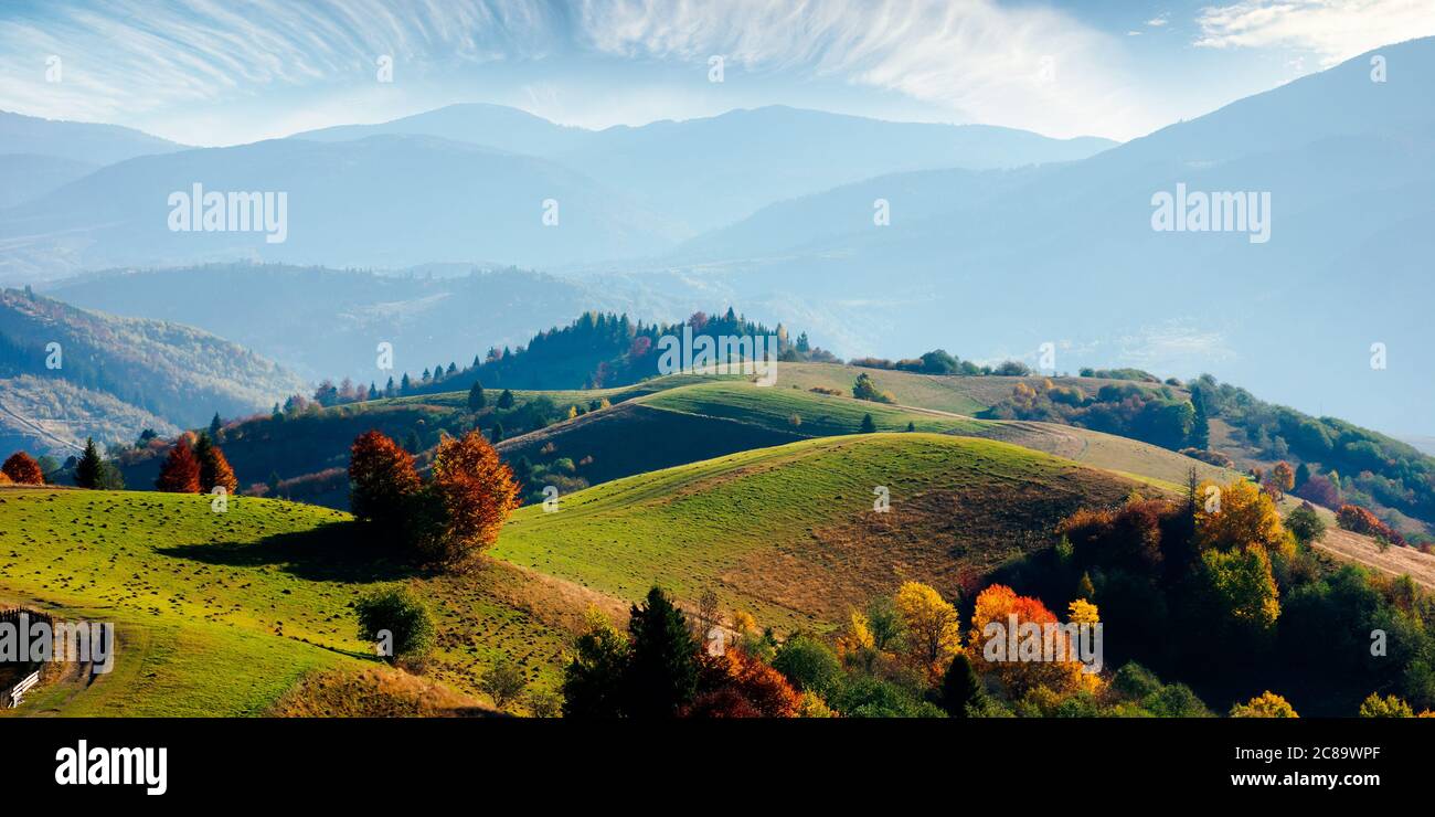 mountainous rural landscape in autumn. fields on rolling hills. fence ...
