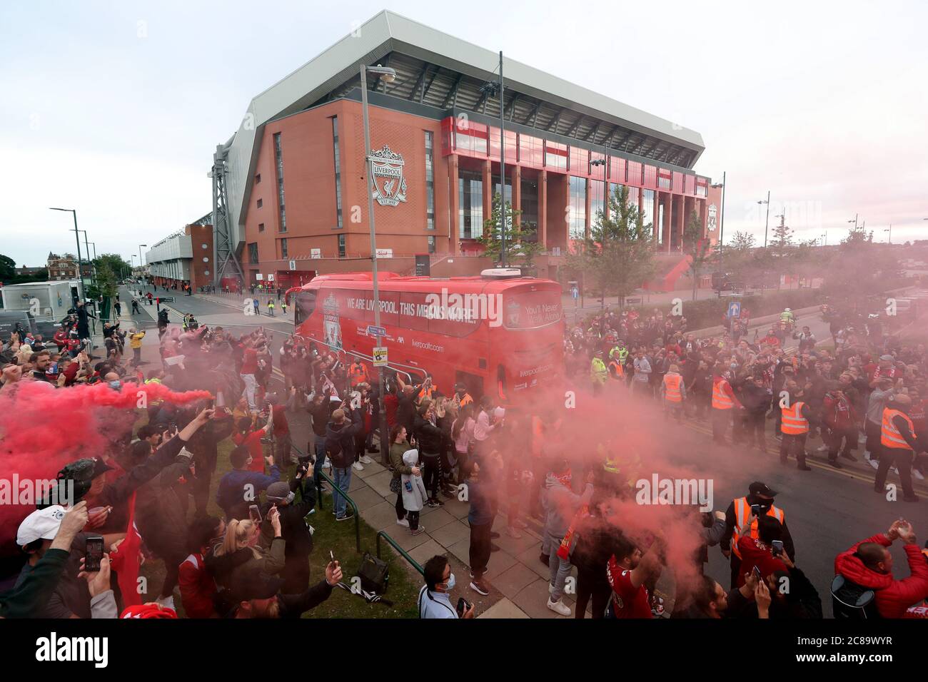 Liverpool fans set of flares outside Anfield as the Liverpool team bus ...