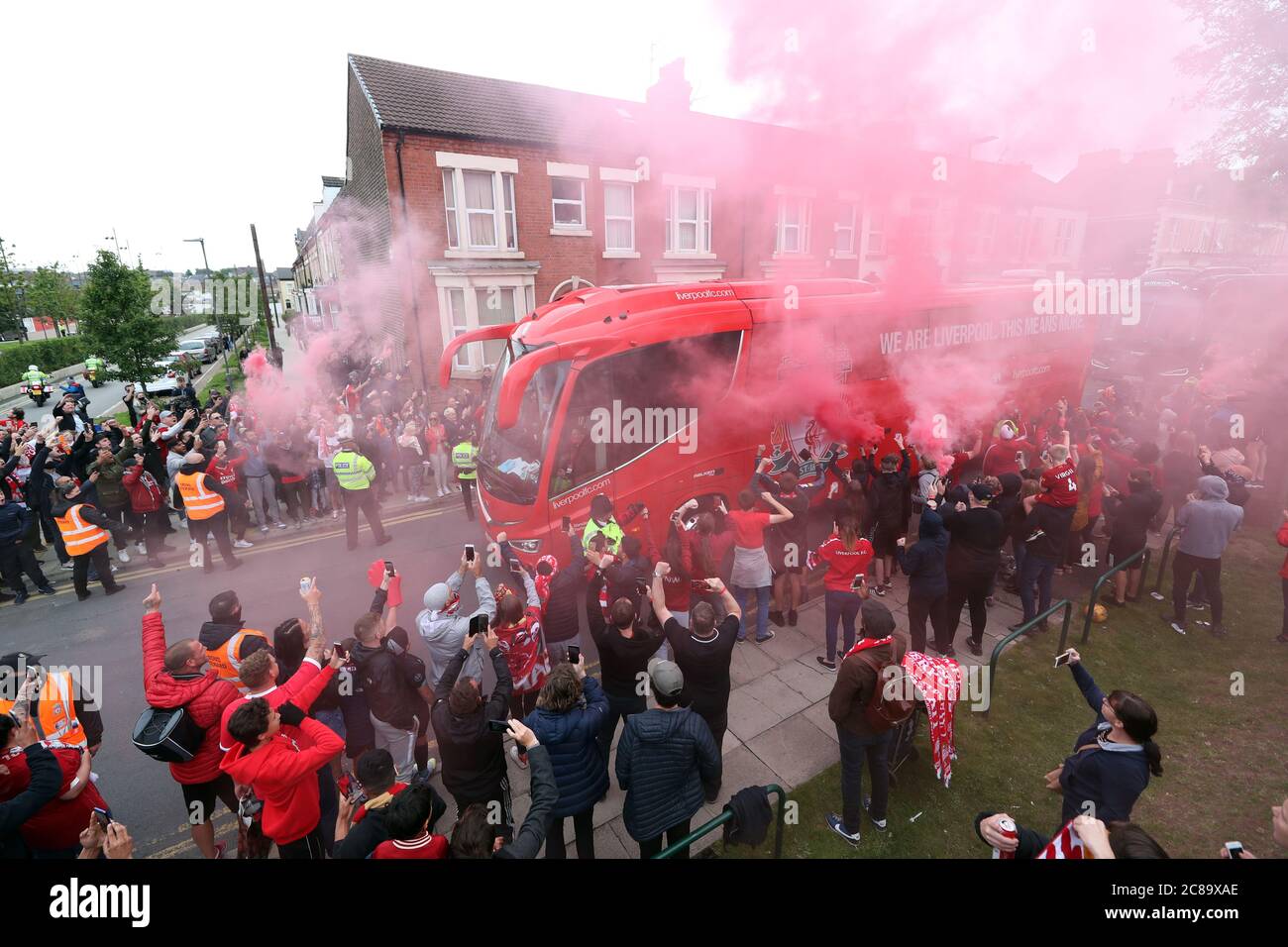 Liverpool fans set off flares outside Anfield as the Liverpool team bus ...