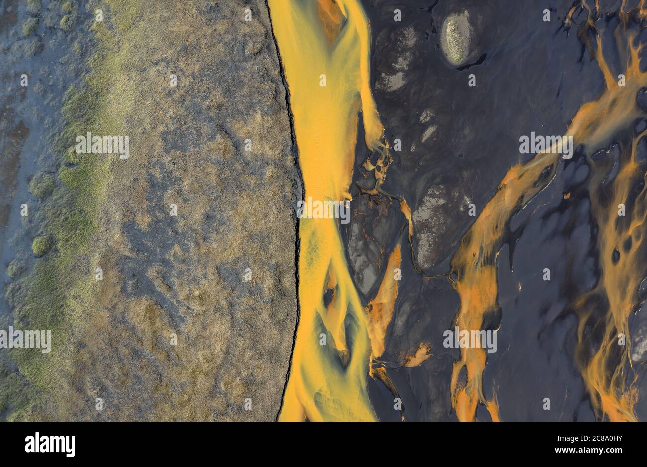Colorful glacier rivers on the south coast of Iceland with black sand ...