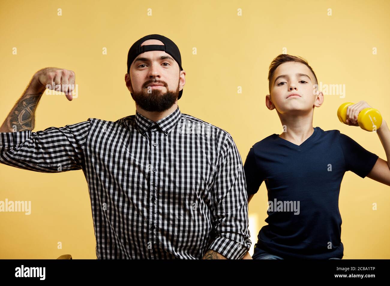 Boy looking biceps hi-res stock photography and images - Alamy