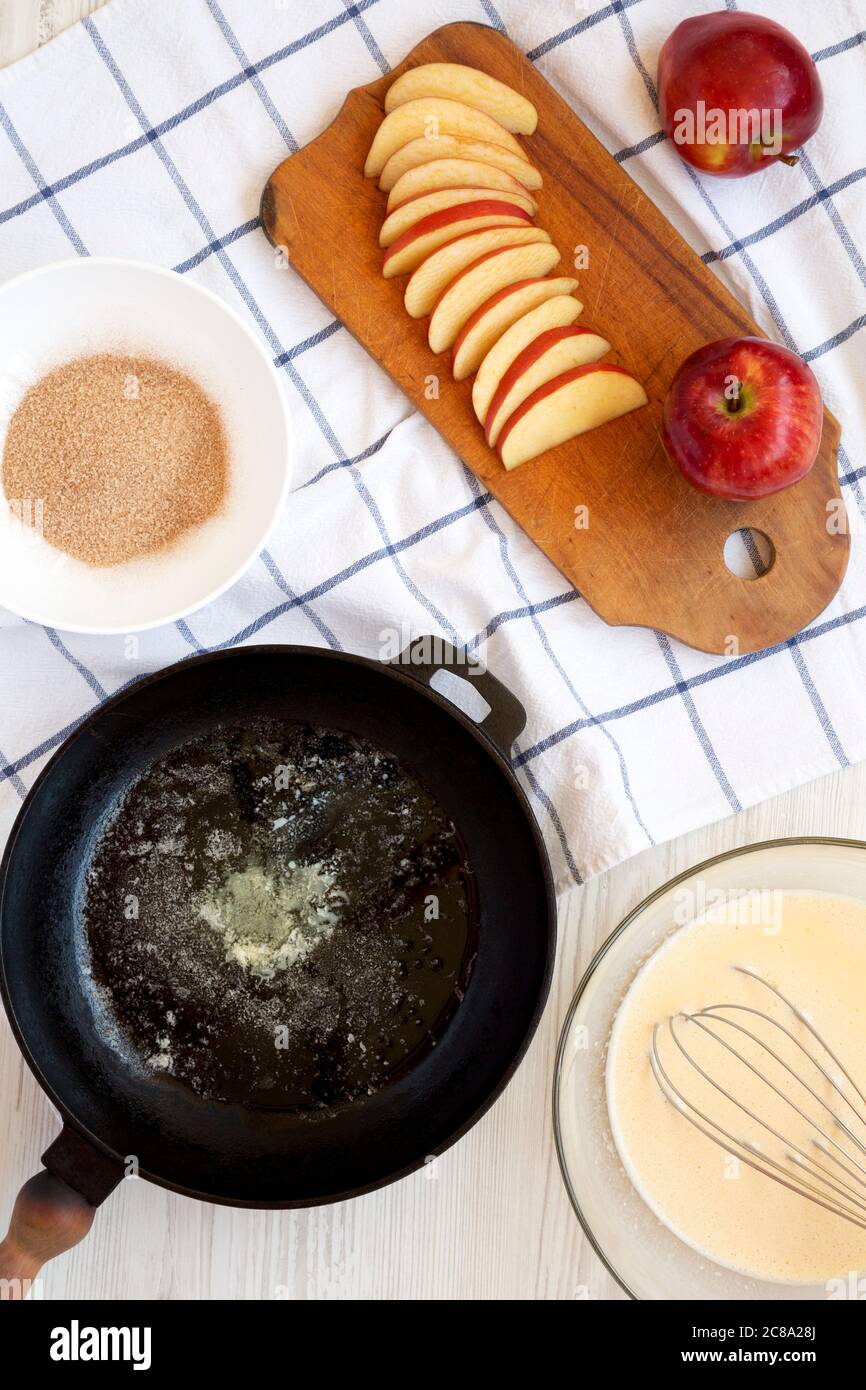 Cooking Apple Dutch Pannekoek Pancake on a white wooden surface, top ...