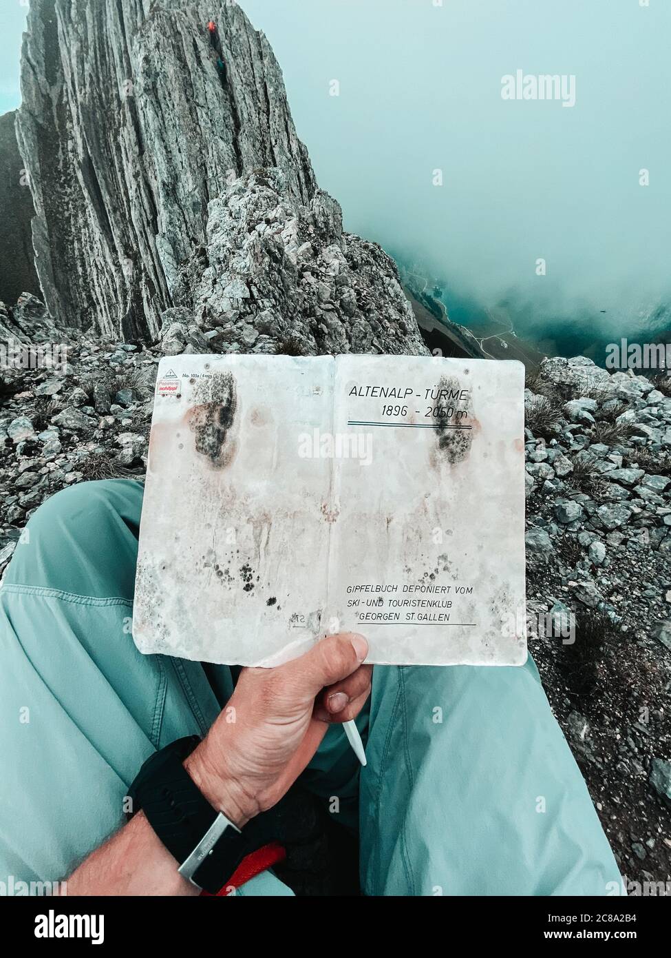 First person shot of alpine book on summit of Swiss peak Stock Photo ...