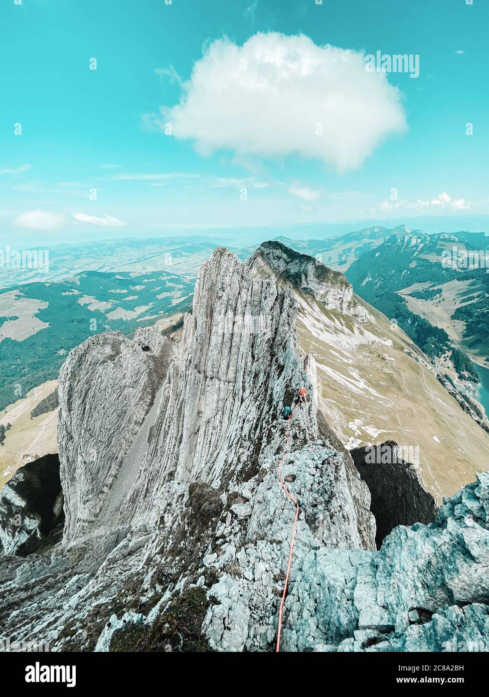 Female Climbers climbing on narrow ridge in Switzerland Stock Photo - Alamy