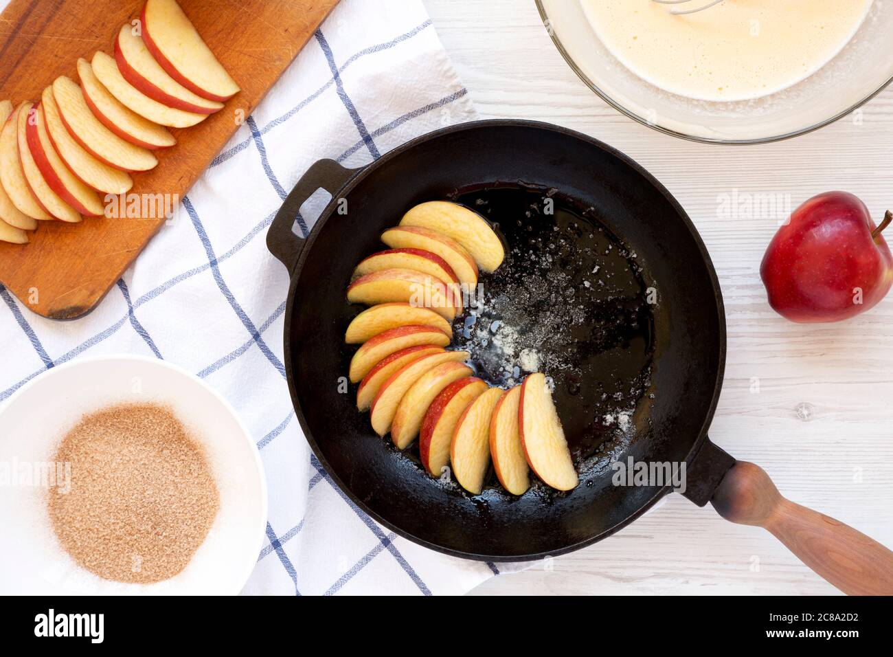 Cooking Apple Dutch Pannekoek Pancake on a white wooden background, top ...