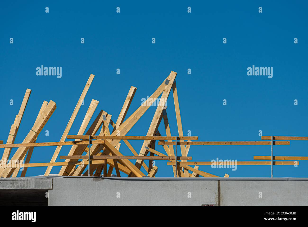 Stacks of planks on the roof of a building at a building site Stock ...