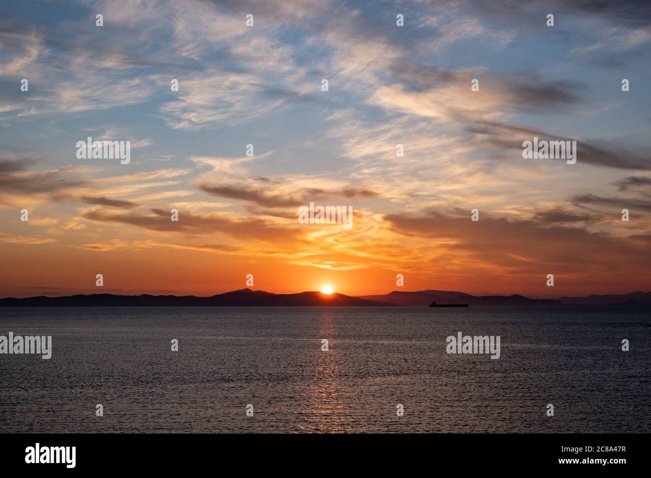 Sunset orange cloudscape over sea water. Dramatic magical sunrise ...