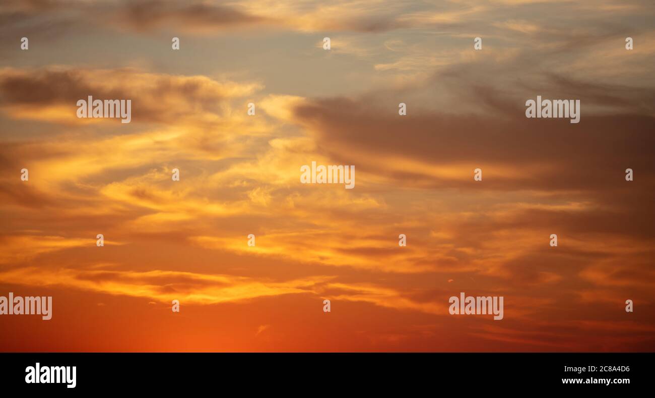 Sunset orange cloudscape background. Dramatic magical sunrise over ...