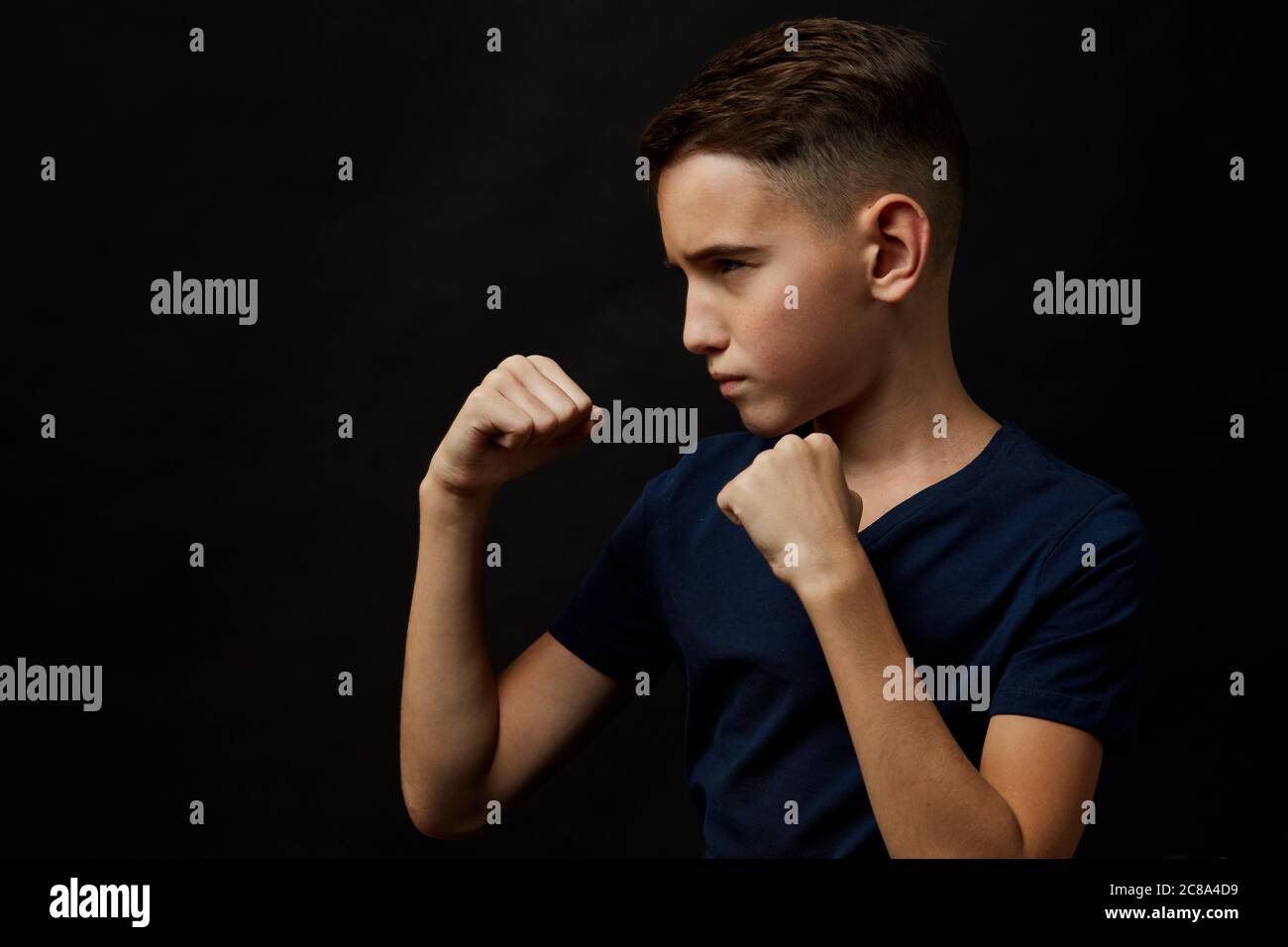 profile of Young boy boxer pose of protection. Look aside Stock Photo ...