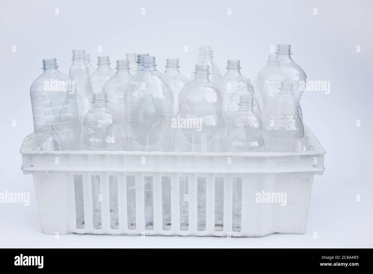 Plastic bottles in a box on a white background Stock Photo - Alamy