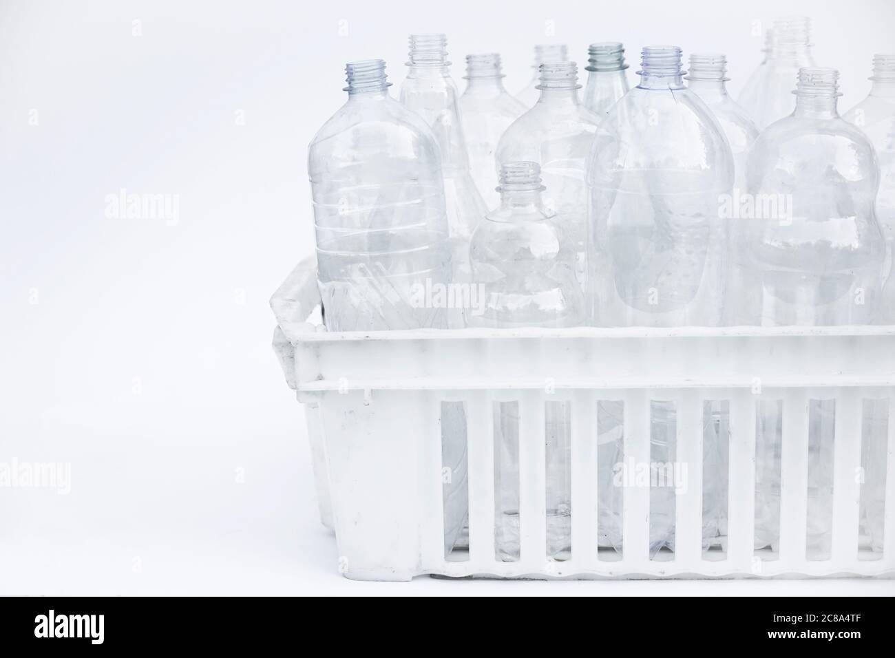 Plastic bottles in a box on a white background Stock Photo - Alamy