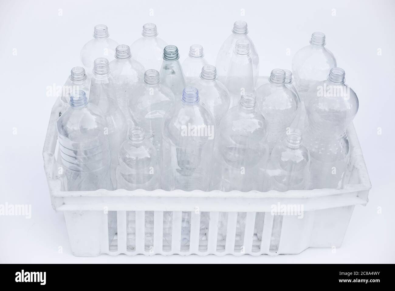 Plastic bottles in a box on a white background Stock Photo - Alamy