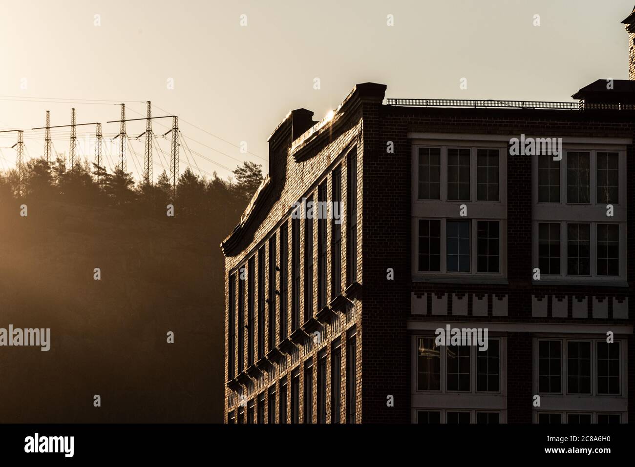 Sun shining on an old industrial building Stock Photo - Alamy