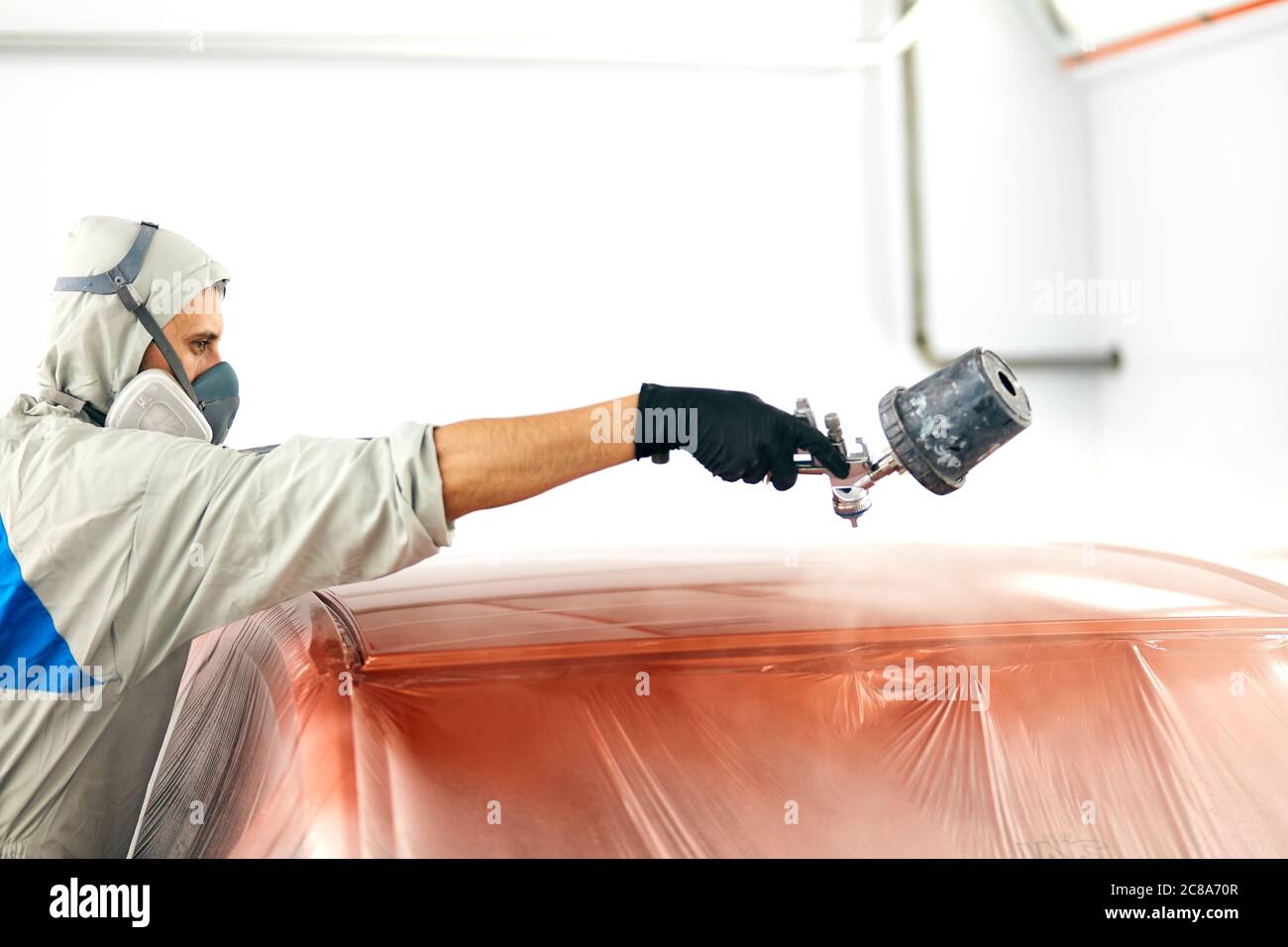 repairman painter in chamber painting automobile car roof Stock Photo ...