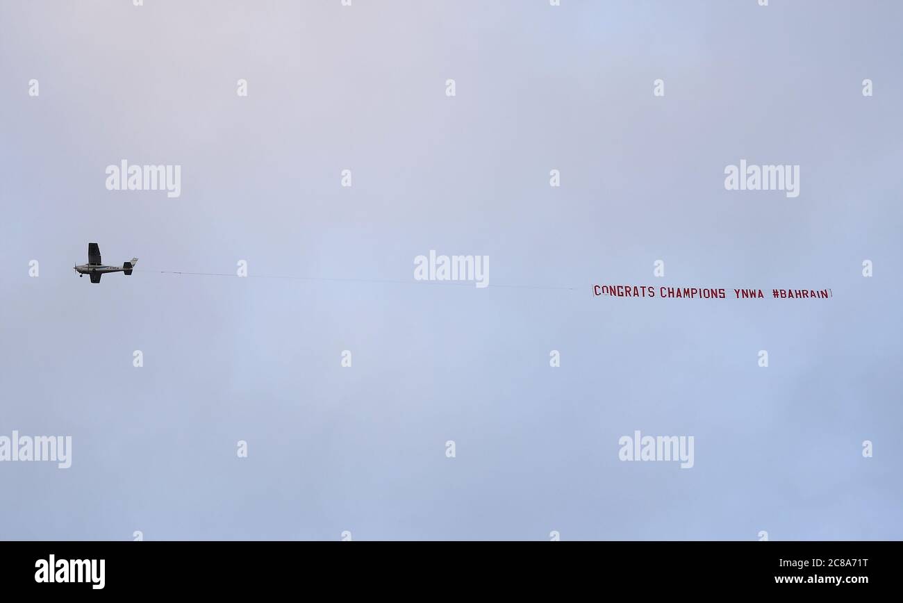 A banner being pulled by a plane reading 'Congrats Champions' is flown ...