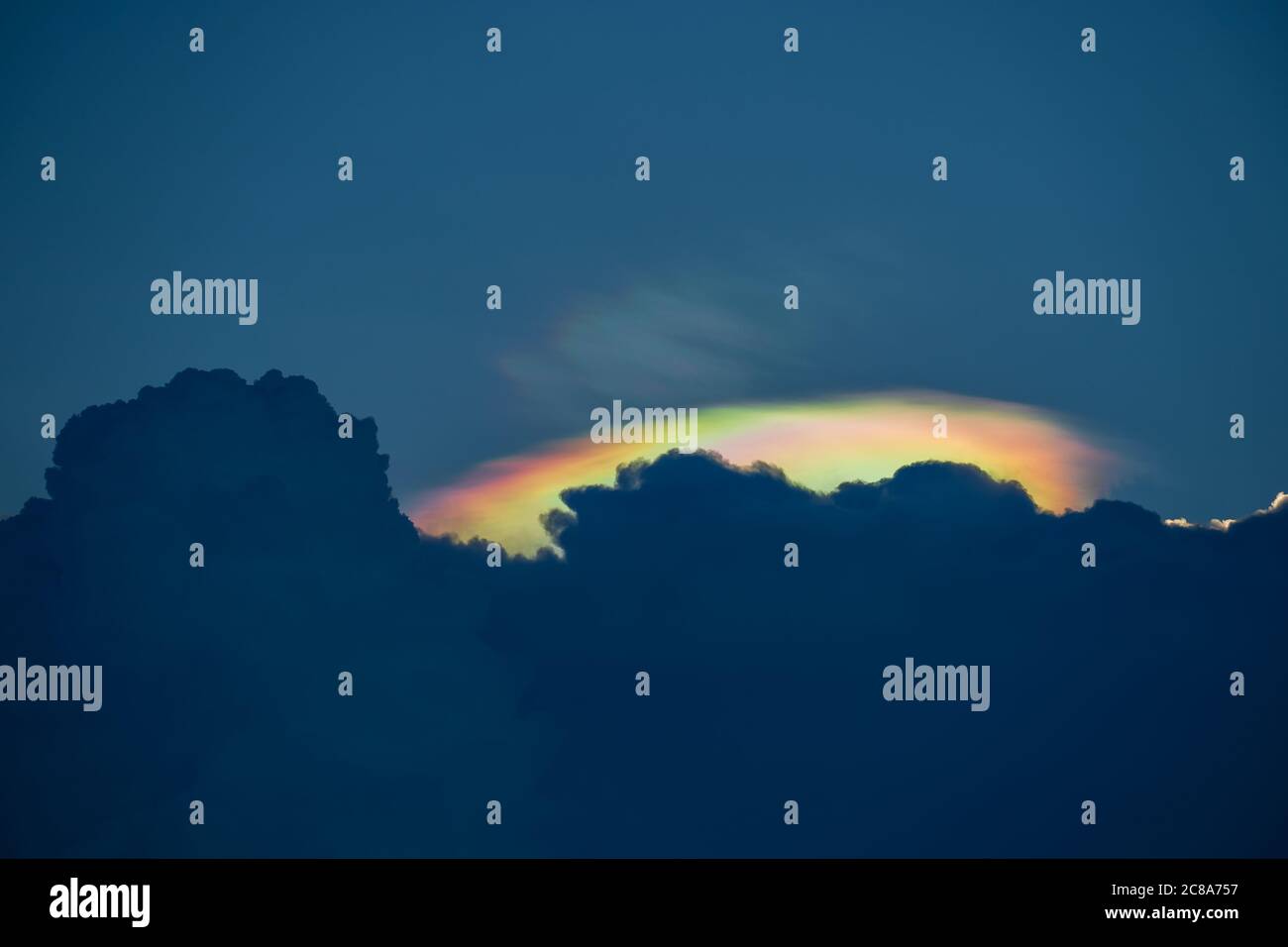 Rainbow clouds over a thundercloud in the evening near city Da Nang ...