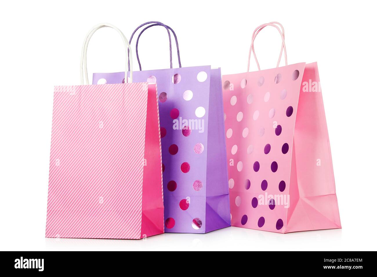 three paper shopping bags isolated on white Stock Photo - Alamy