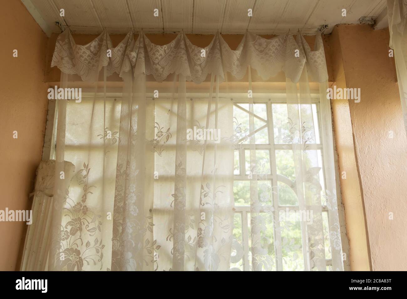Old house inside old window. Grandparents' house Stock Photo - Alamy