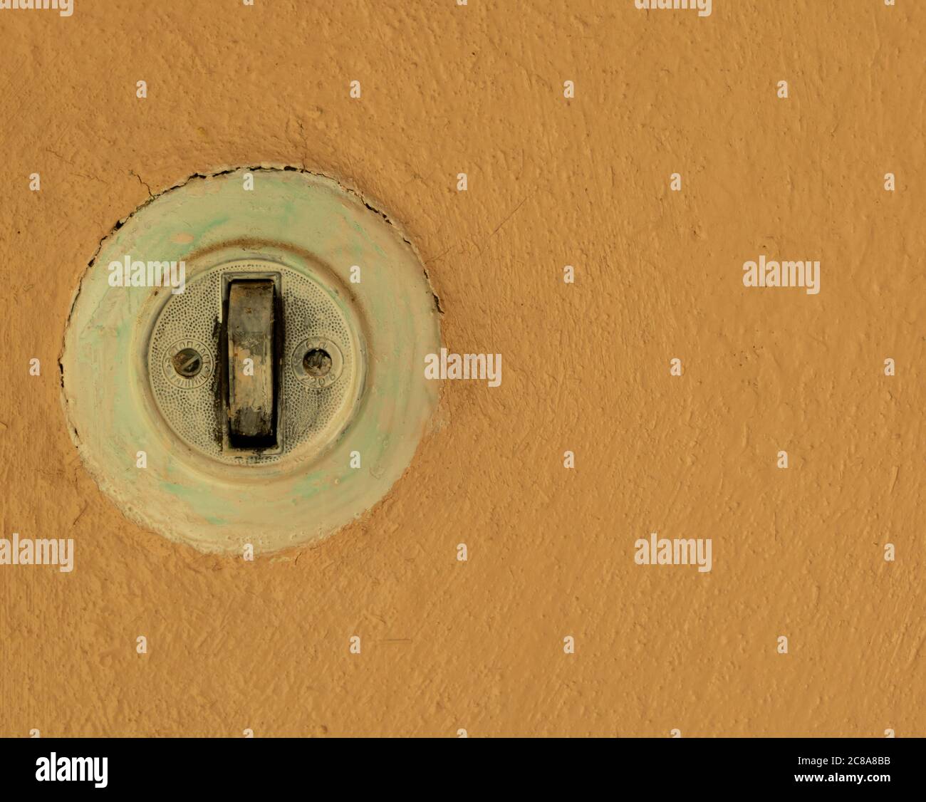 Soviet old style electric switch installed in the wall Stock Photo - Alamy