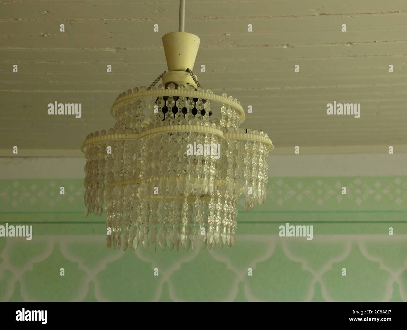 Old style chandelier hanging from the ceiling Stock Photo - Alamy
