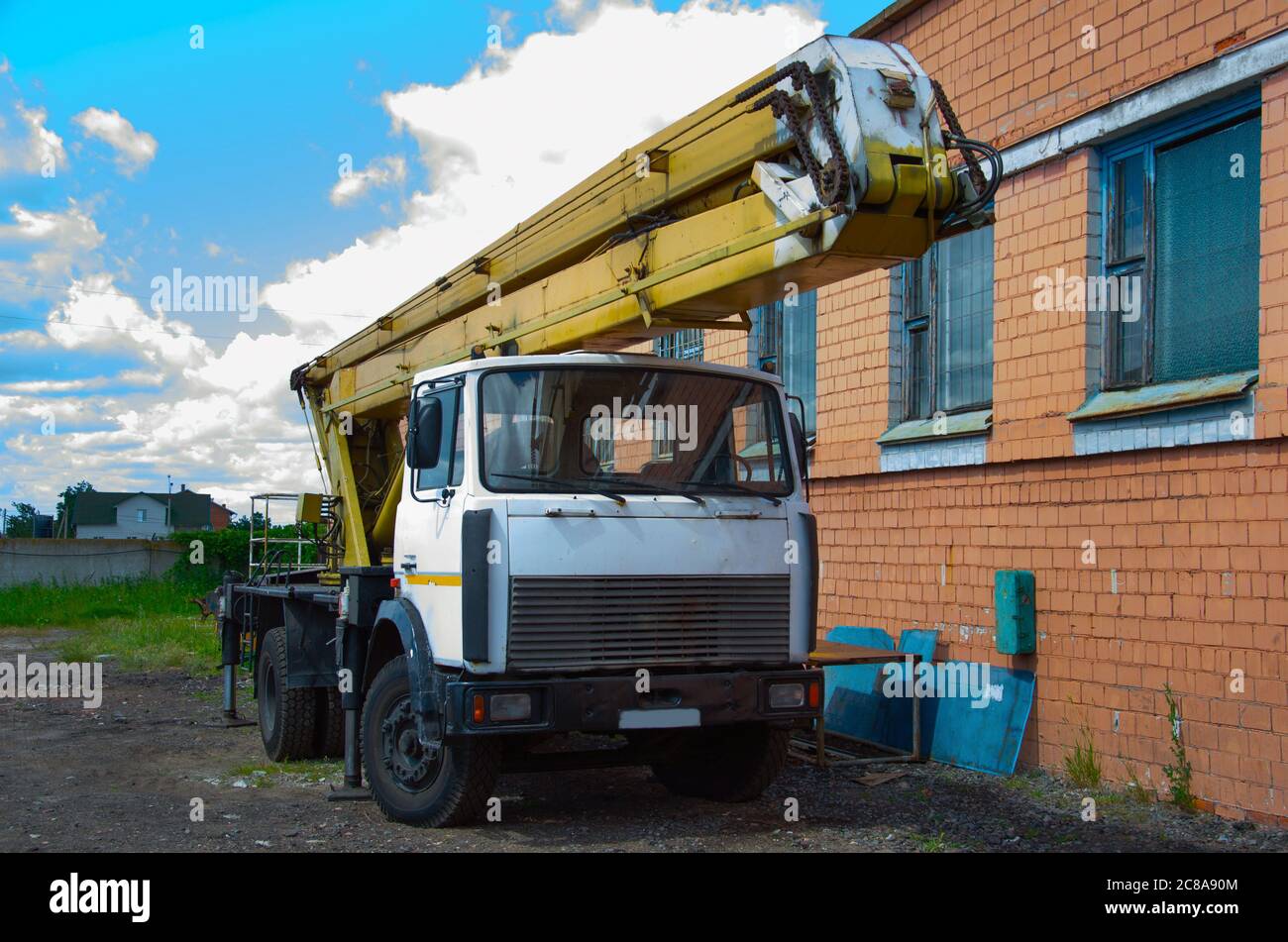 Mobile Crane on a road and tower crane in construction site Stock Photo ...