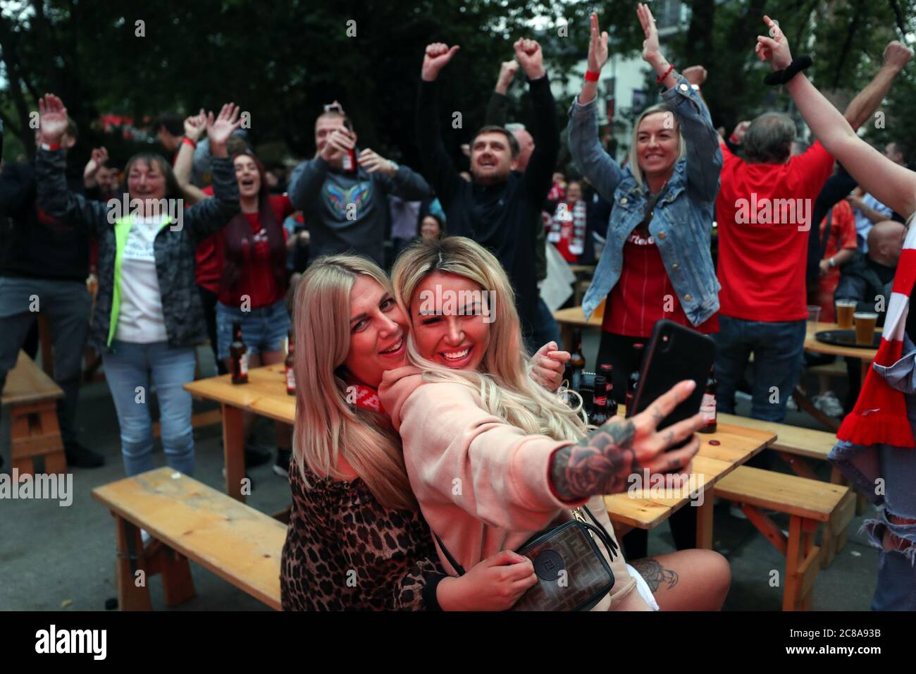Liverpool fans celebrate their sides second goal whilst taking a selfie ...
